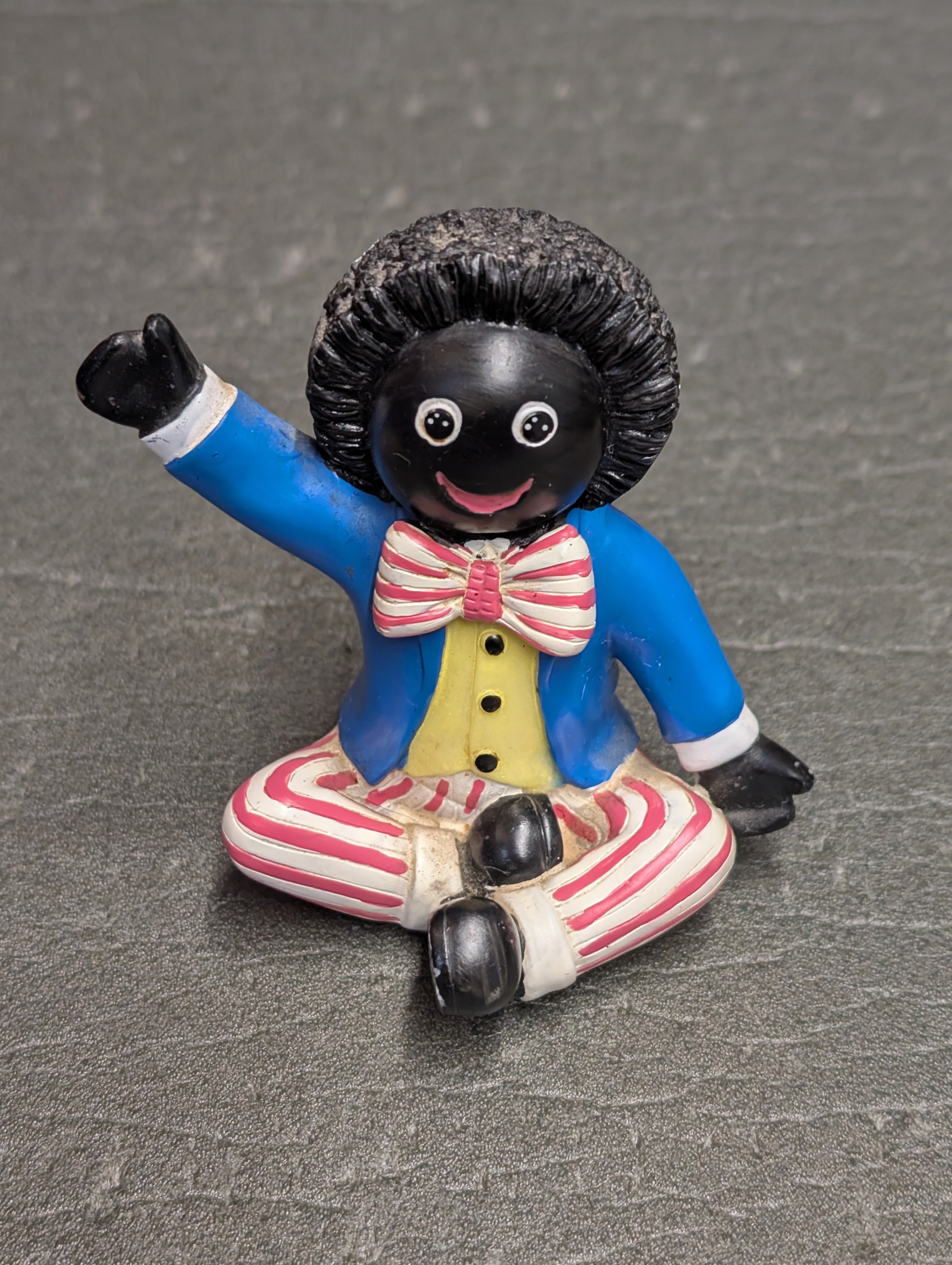 Sitting Golly Raised Arm Figure Blue Jacket – GollyBadges.com